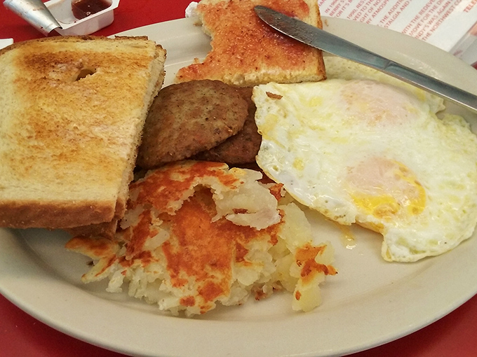 Breakfast perfection on a plate. That crispy hash brown edge deserves its own fan club, while those eggs are sunshine incarnate.