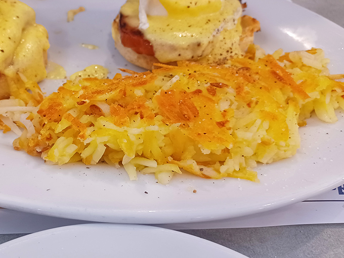 These hash browns achieve the culinary holy grail: golden-crisp exterior giving way to tender interior. The kind of potato perfection worth setting an alarm for.