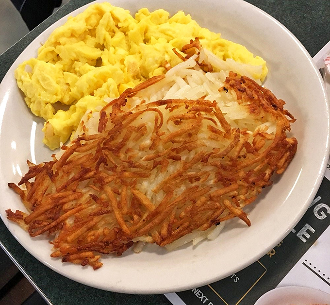 Hashbrowns crisped to golden perfection alongside fluffy scrambled eggs. Some relationships are just meant to be.