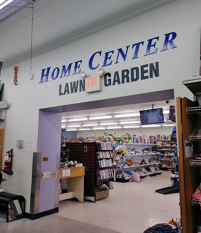 The Home Center sign beckons like a portal to another dimension. Beyond lies a garden of earthly bargains.