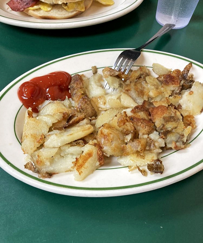 Home fries that deserve their own zip code. Crispy, seasoned potato perfection that makes hash browns jealous.