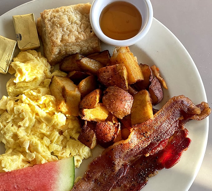 Breakfast of champions, Texas-style&mdash;golden scrambled eggs, crispy home fries, and bacon cooked to that perfect point between chewy and crisp.