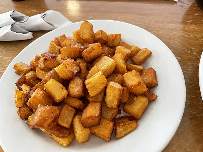 These aren't just home fries; they're golden nuggets of potato perfection that make you question why you ever settled for drive-thru hash browns.