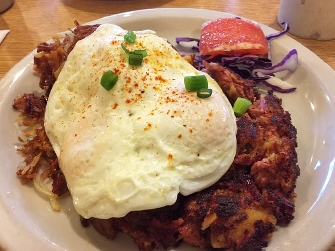 This isn't just breakfast – it's edible architecture. Crispy hash browns supporting a masterpiece of eggs and hollandaise that would make Michelangelo weep with joy.