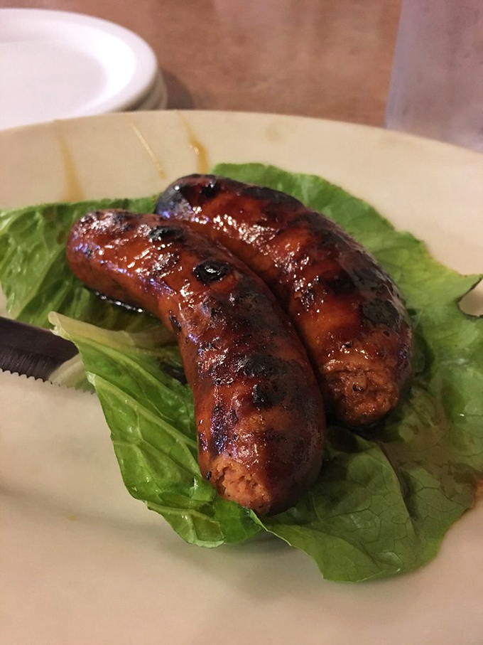 Hot links on a bed of crisp lettuce&mdash;a nod to "health food" that fools absolutely no one. These smoky, juicy sausages are what dreams are made of.