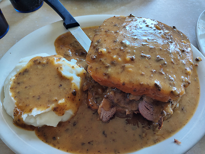 The hot roast beef sandwich&mdash;where gravy isn't just a condiment but a philosophy. Tender meat swimming in peppery goodness atop mashed potatoes that clearly never came from a box.