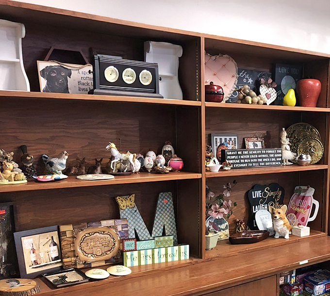 Wooden shelves showcase whimsical treasures that somehow make you nostalgic for things you never owned in the first place.