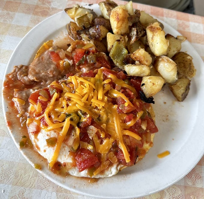 Huevos Rancheros that would make your abuela proud &ndash; a fiesta of flavors topped with melted cheese and served with potatoes that could convert any hash brown skeptic.