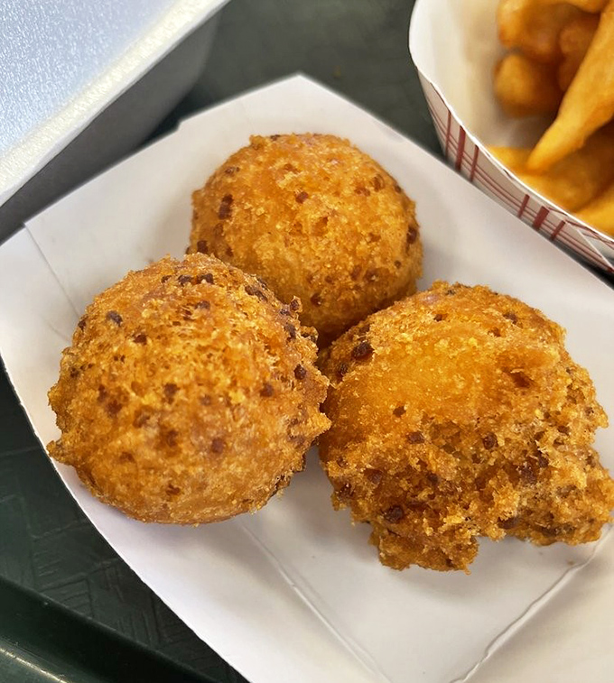 These hushpuppies aren't telling secrets, but they're whispering sweet nothings of cornmeal perfection to your taste buds.