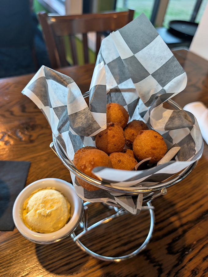 Hush puppies that actually make you want to speak up&mdash;golden-fried perfection with a hint of sweetness, served with butter that melts just looking at these hot little spheres of joy.
