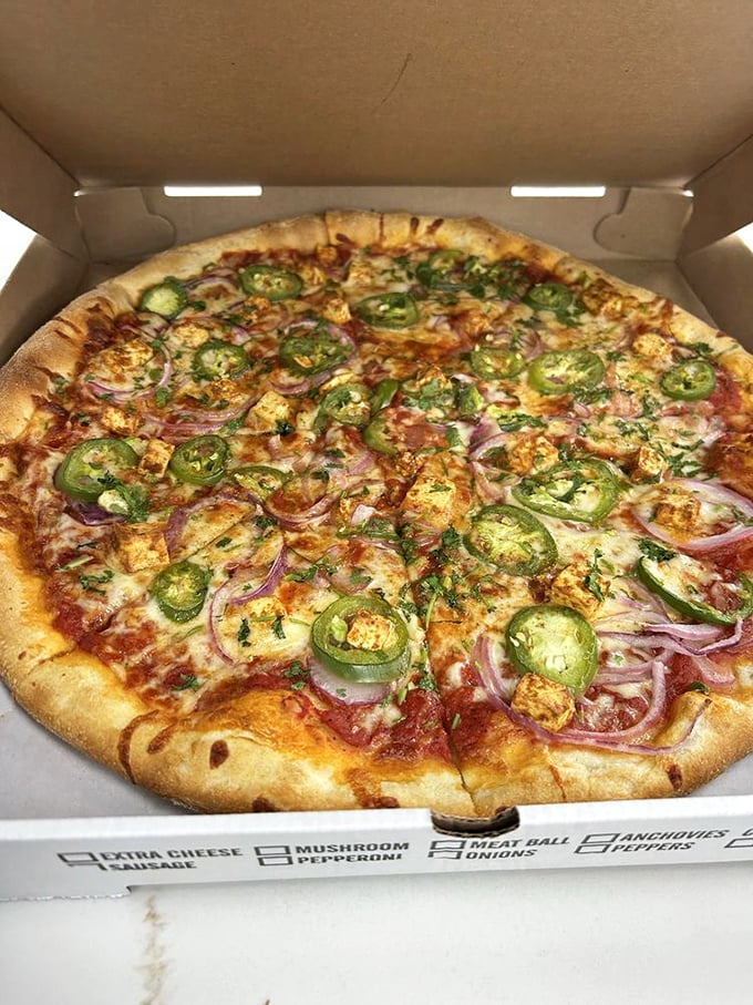 This pizza isn't just food&mdash;it's art. Jalape&ntilde;os and red onions create a colorful masterpiece atop that perfectly baked crust.
