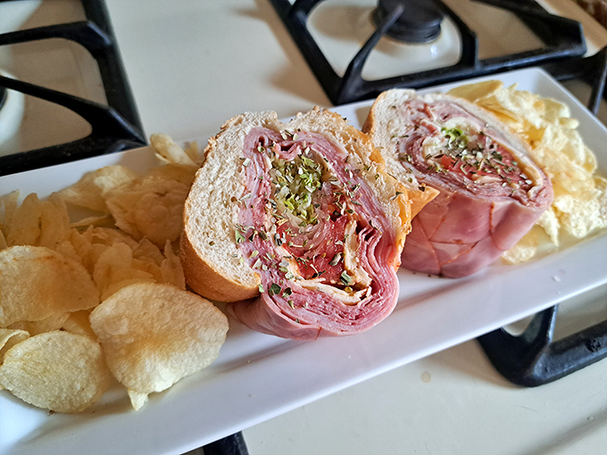 The Italian hoagie cross-section reveals geological layers of meat and cheese that would make any archaeologist hungry.