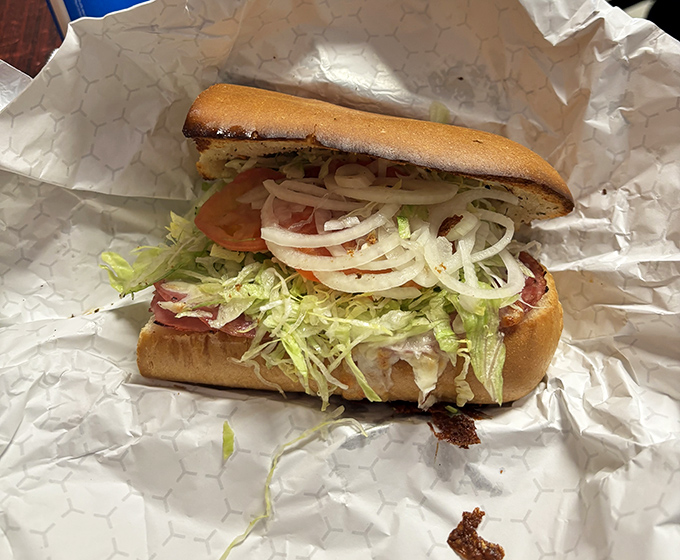 This isn't just a sandwich; it's an architectural marvel of Italian ingredients. The hoagie that launched a thousand napkins.