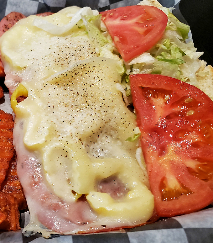 This isn't just a sandwich; it's architecture&mdash;layers of meat, cheese, and fresh veggies creating the skyscraper of lunch options.