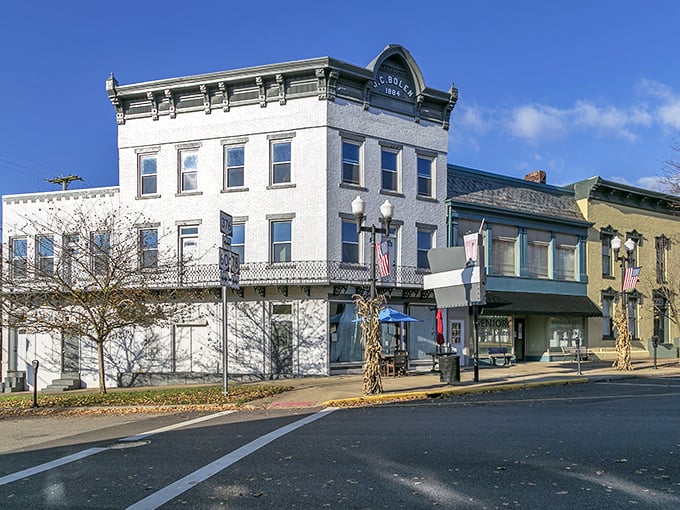 The JC Bolen Building's pristine white facade has witnessed over a century of Main Street life, standing tall while empires rose and fell elsewhere.