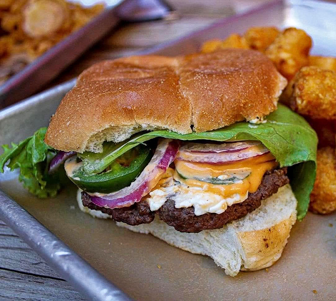 This isn't just a burger—it's architecture with flavor. The structural integrity of that bun deserves an engineering award.