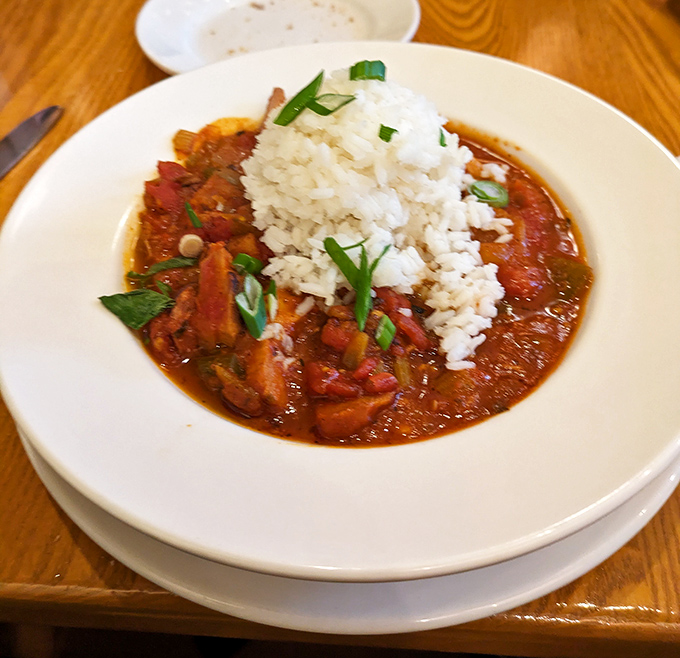 A symphony of spice and everything nice. This hearty dish with its mountain of rice is what would happen if comfort food went to culinary school.