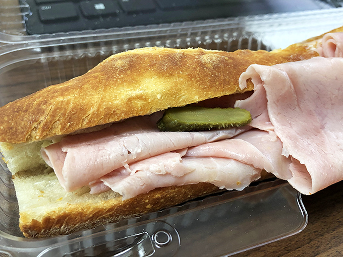 The humble ham sandwich achieves its highest form here. Crusty baguette, generous ham, and the crucial cornichon pickle&mdash;simplicity that would make a Frenchman weep.
