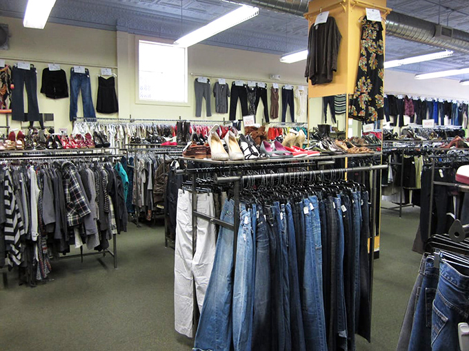 Denim heaven awaits with rows of jeans hanging like blue soldiers at attention, ready to march into your wardrobe without declaring war on your wallet.