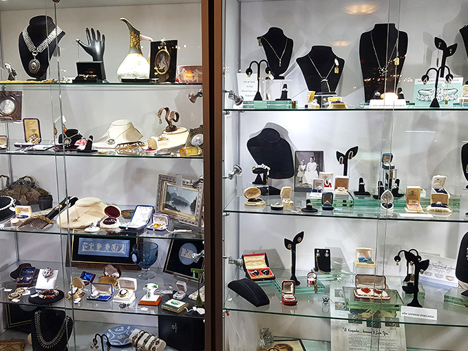 Behind glass, generations of jewelry wait for second chances. Each piece holds secrets of anniversaries, graduations, and "just because" moments from decades past.