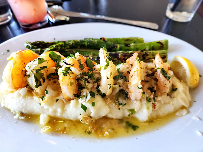 Plump shrimp lounging on a bed of creamy mashed potatoes with asparagus standing at attention&mdash;comfort food that got dressed up for a night out.