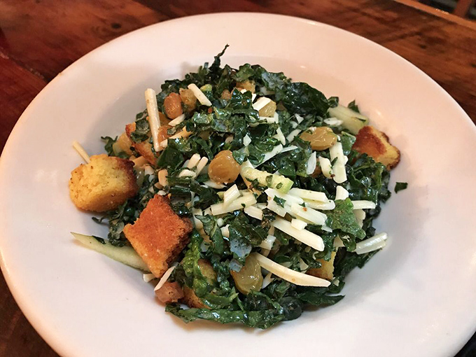 This isn't your sad desk lunch kale salad. It's a celebration of textures with cornbread croutons and cheese that might convert even the most devoted carnivore.