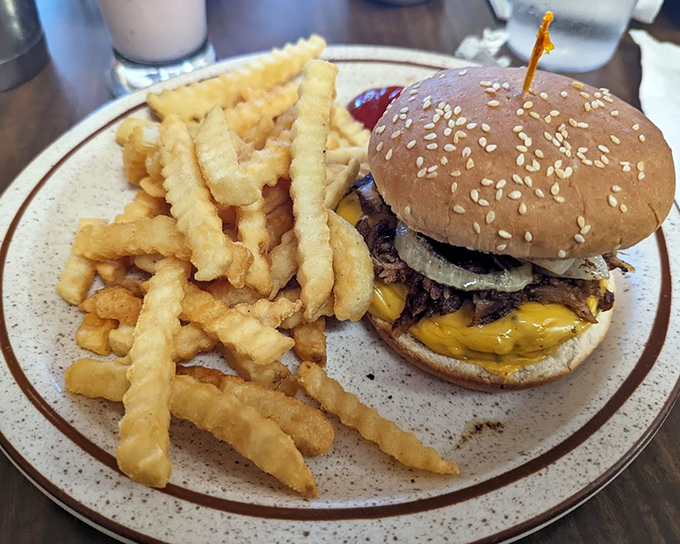 This isn't just a burger &ndash; it's the Cowboy Burger architecture at its finest, where every bite delivers the perfect ratio of beef, cheese, and those gloriously crispy fries.