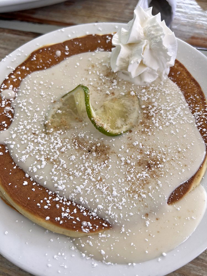 Key Lime pancakes that capture Florida's signature flavor in fluffy form, dusted with powdered sugar like a sweet morning snowfall.