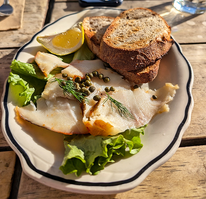 Smoked fish with capers and fresh bread&mdash;proof that breakfast can be sophisticated without being pretentious.