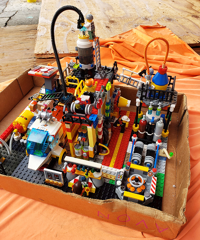 LEGO masterpieces waiting for their forever homes. This intricate creation probably cost less than a single new set at the mall. Childhood dreams, adult prices!