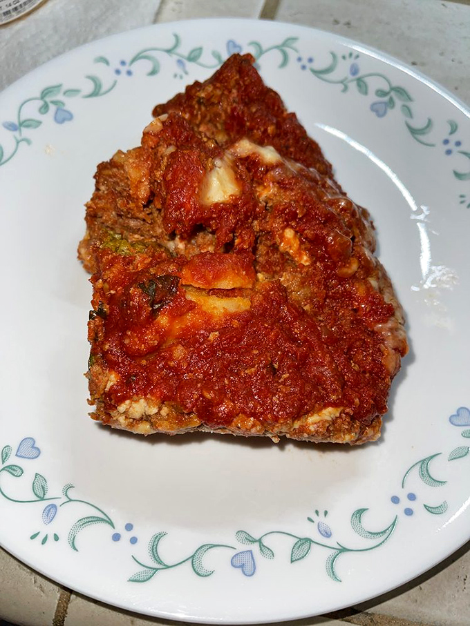 This isn't just lasagna; it's a geological marvel of pasta, sauce, and cheese that would make any Italian grandmother weep with pride.