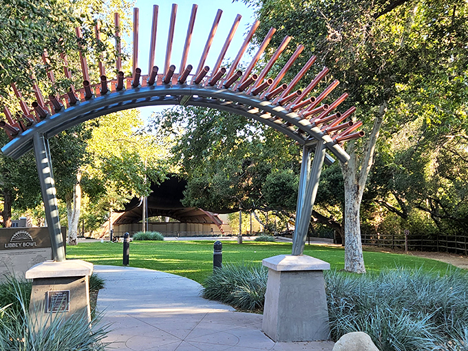 Libbey Park's artistic entrance arch frames the path to the bowl where music festivals transform summer evenings into magical community gatherings.