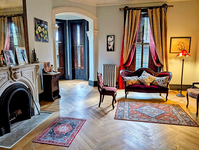 Elegant herringbone floors and period furnishings create a parlor where you half expect to find a Victorian novel's worth of family secrets.