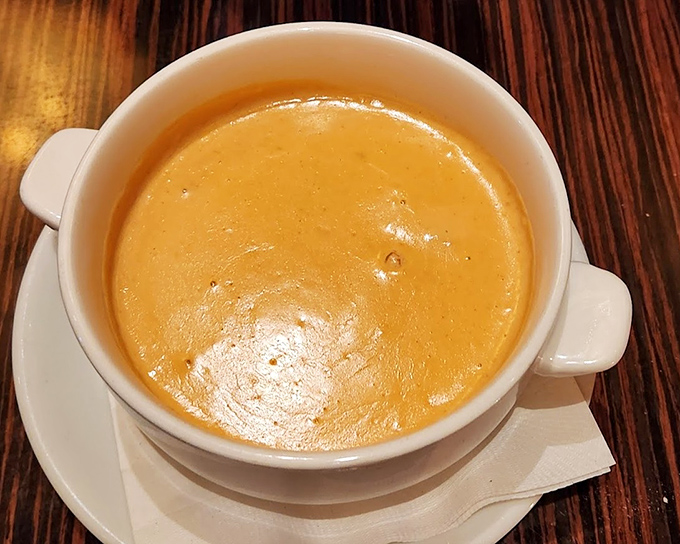 This lobster bisque isn't just soup&mdash;it's liquid velvet with a college degree. The golden hue promises (and delivers) richness that makes you want to propose to your spoon.