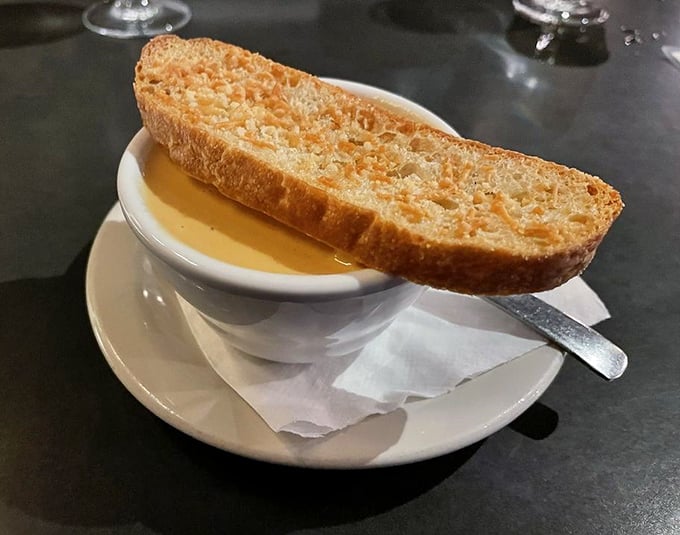 This isn't just soup with bread&mdash;it's lobster bisque with purpose, the kind that makes you consider drinking straight from the bowl when nobody's looking.