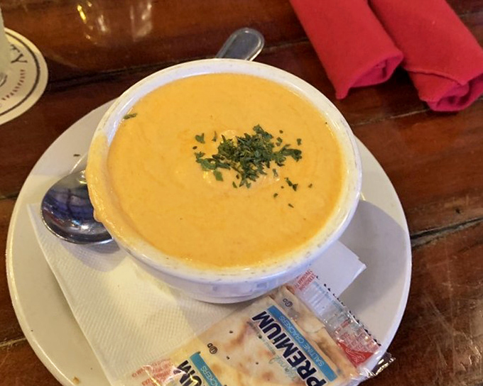 Sunshine in a bowl! This velvety lobster bisque, garnished with fresh herbs, is the kind of liquid gold that makes you forget your troubles.