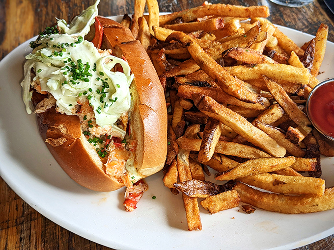 The lobster roll that launched a thousand return visits. That buttery, toasted bun cradles sweet lobster meat like it's been waiting its whole life for this moment.
