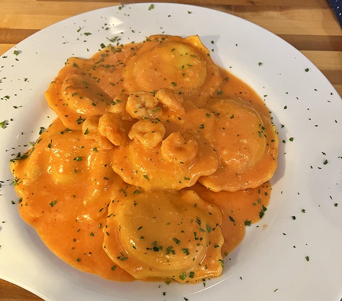 The legendary lobster ravioli in cognac cream sauce&mdash;pillowy pasta pockets filled with treasure from the sea. Worth every calorie.