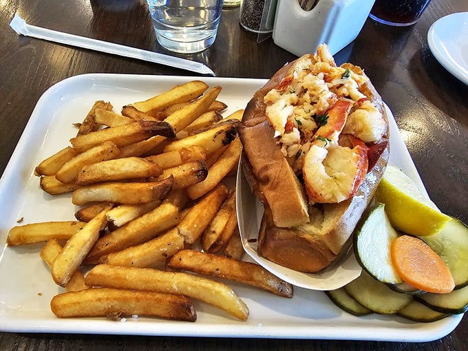 The lobster roll arrives like a celebrity&mdash;golden fries as the entourage, pickles as security detail, and that buttery roll stealing the spotlight.