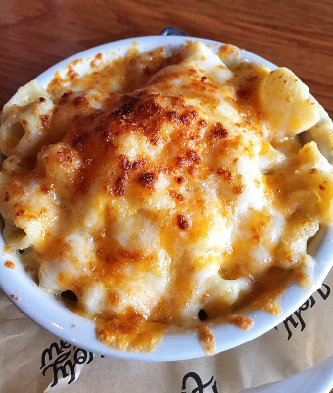 Mac and cheese arrives bronzed and bubbling, looking like what would happen if comfort food went to finishing school.