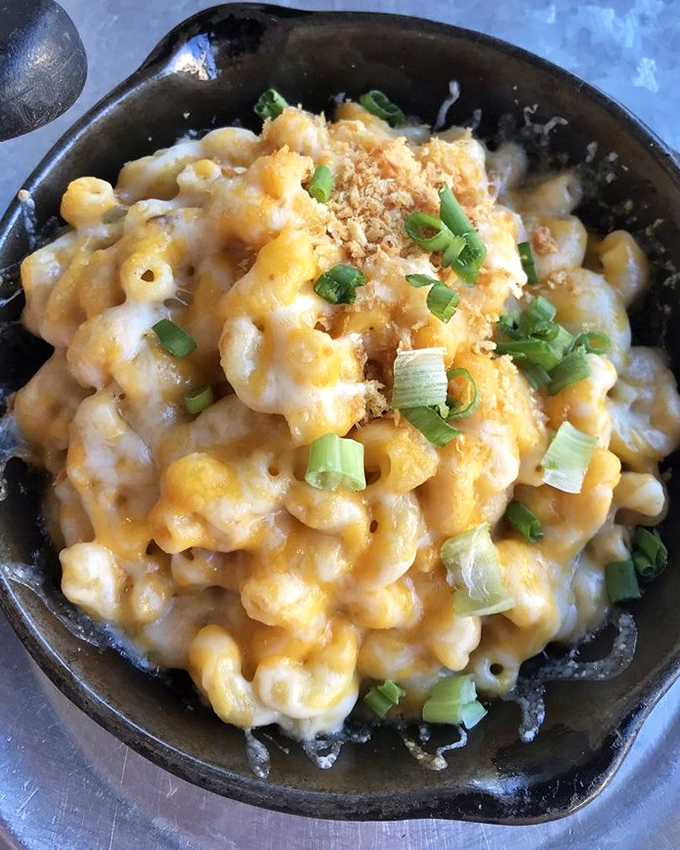 Mac and cheese so creamy and golden, it could star in its own comfort food commercial.