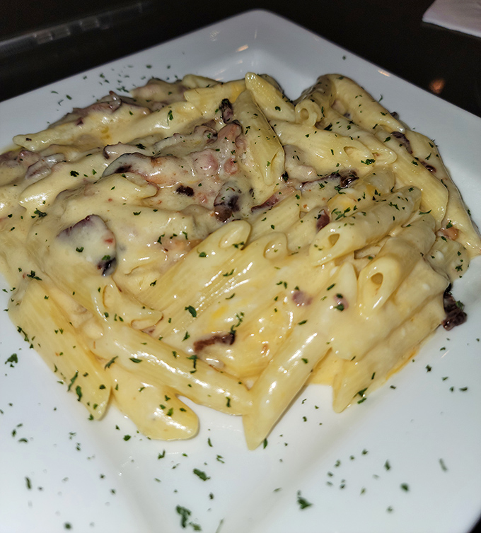 Mac and cheese that's having an identity crisis as a work of art. Those creamy spirals of pasta are what comfort food dreams are made of.