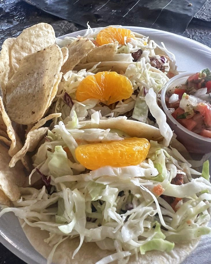 Fresh mahi meets crispy cabbage slaw in these colorful tacos that taste like a tropical vacation on a plate.
