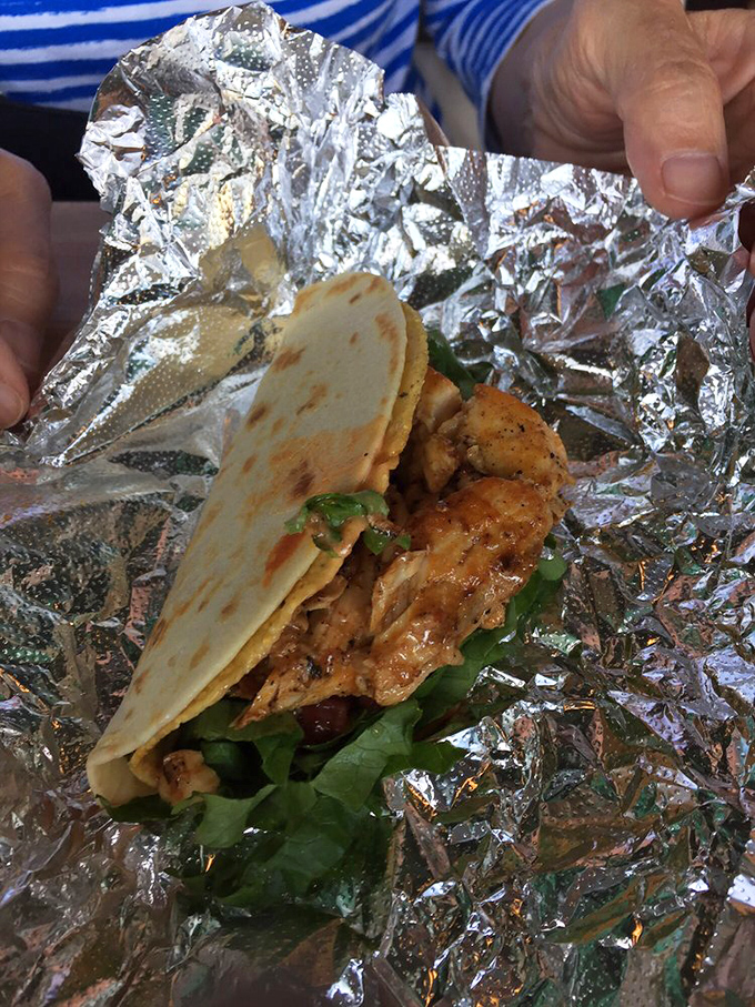 The mahi taco reveals itself like a delicious present being unwrapped. Those perfectly charred edges tell you someone in the kitchen really cares.