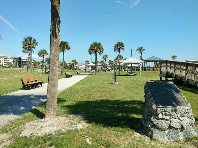 Palm trees standing guard over picnic pavilions at Main Beach Park&mdash;nature's perfect combination of shade and sunshine for your afternoon escape.
