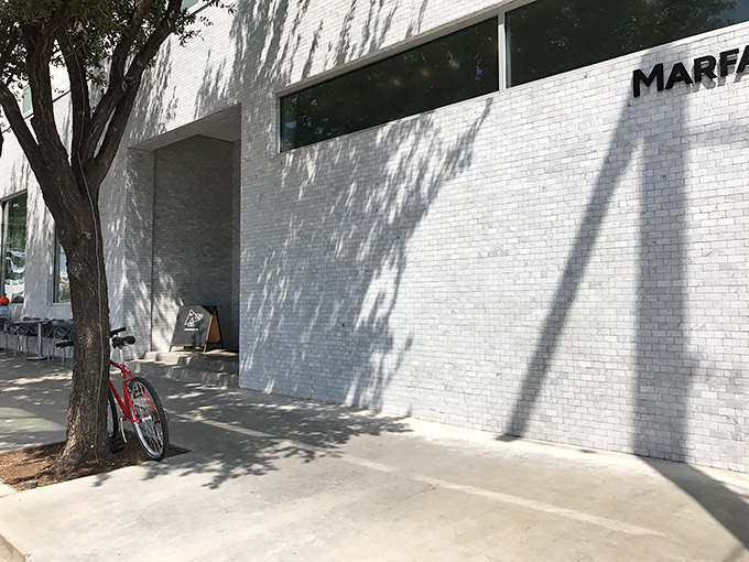 Clean lines and dappled shadows create the perfect backdrop for Marfa's literary heart at the Marfa Book Company.
