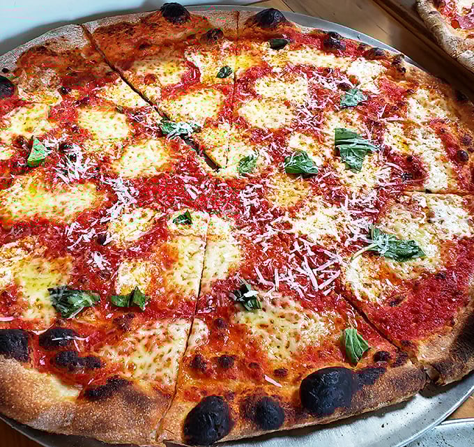 The Margherita &ndash; pizza in its purest form. Red sauce, melted mozzarella, and fresh basil creating the Italian flag you actually want to pledge allegiance to.