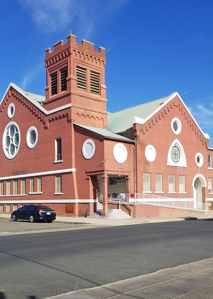 This striking brick church with its distinctive round windows adds architectural character to Porterville's skyline, a landmark of community gathering.