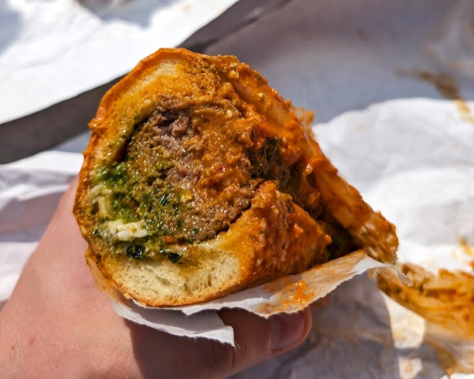 Behold the meatball sub in its natural habitat&mdash;a study in contrasts with golden-brown exterior and savory filling that demands your full attention.
