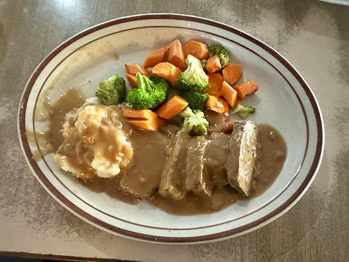 The meatloaf arrives with all the fixings, proving that some classics never go out of style or flavor.